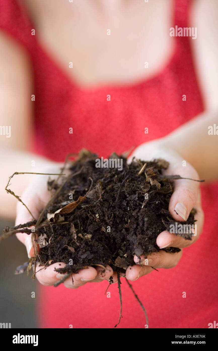 Hands holding home made compost at the Centre for Alternative ...
