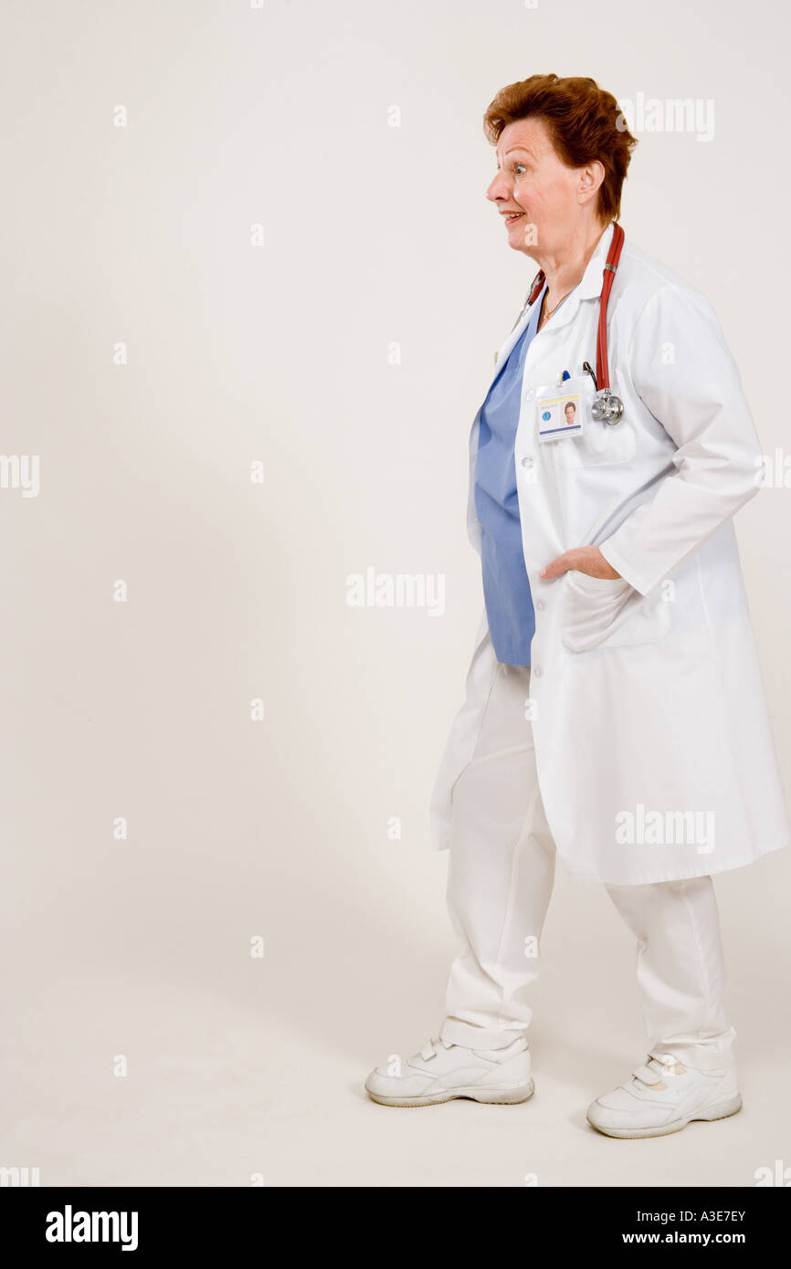 Female doctor walking by Stock Photo - Alamy