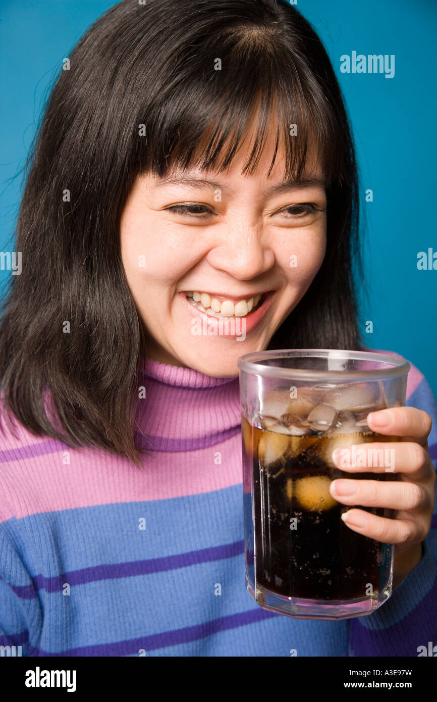 Woman enjoying a cold glass of soda pop Stock Photo - Alamy