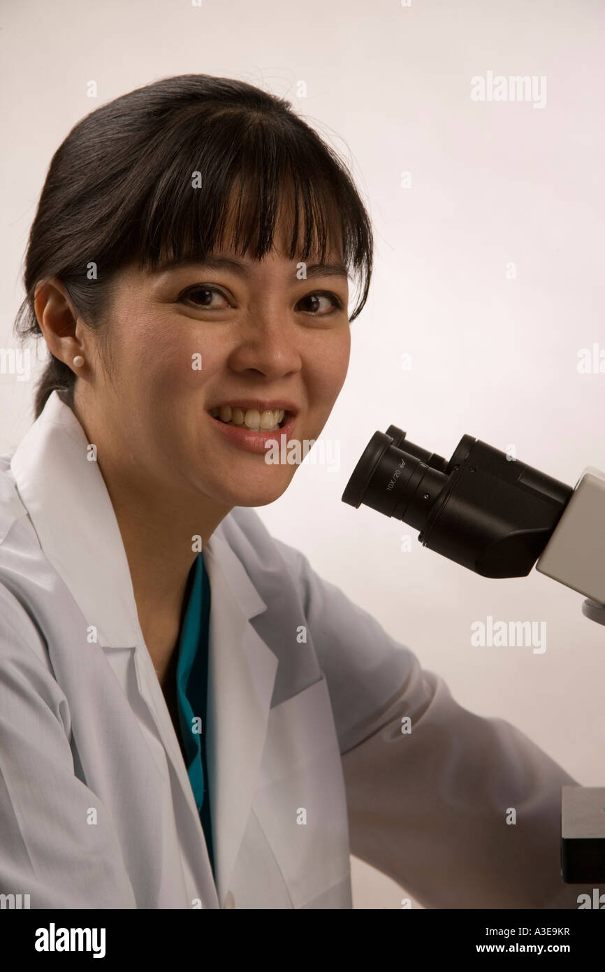 Scientist poses with her microscope in her lab Stock Photo - Alamy