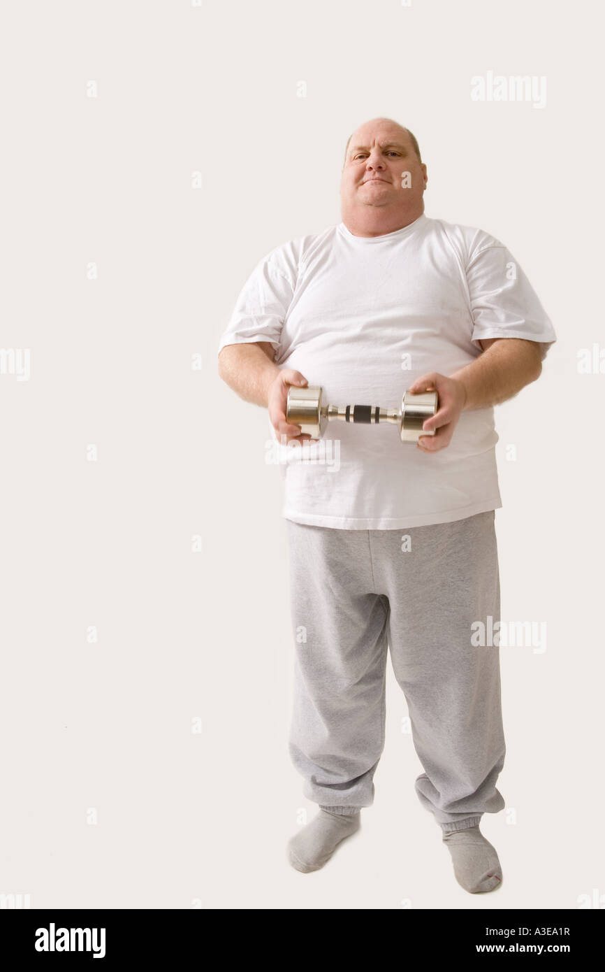 Overwieght male exercises using small barbell weights Stock Photo - Alamy