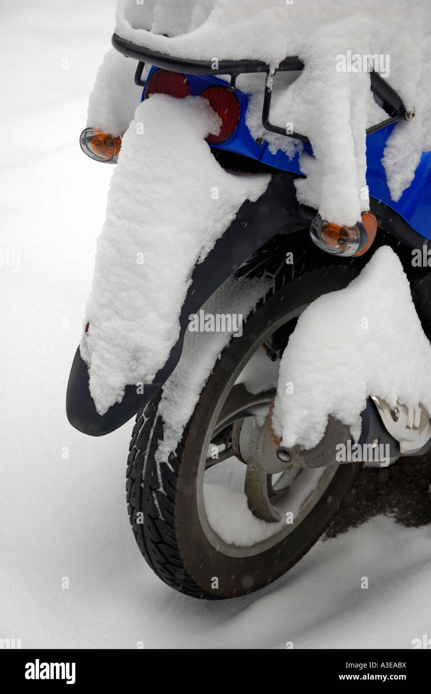 Snow covered motorbike Stock Photo - Alamy