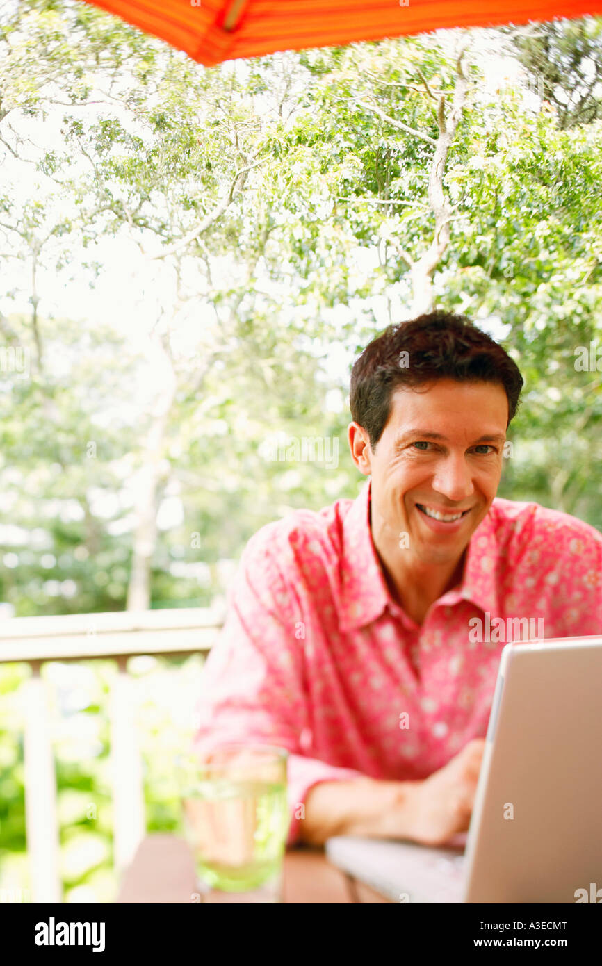 Portrait of a mature man using a laptop Stock Photo - Alamy
