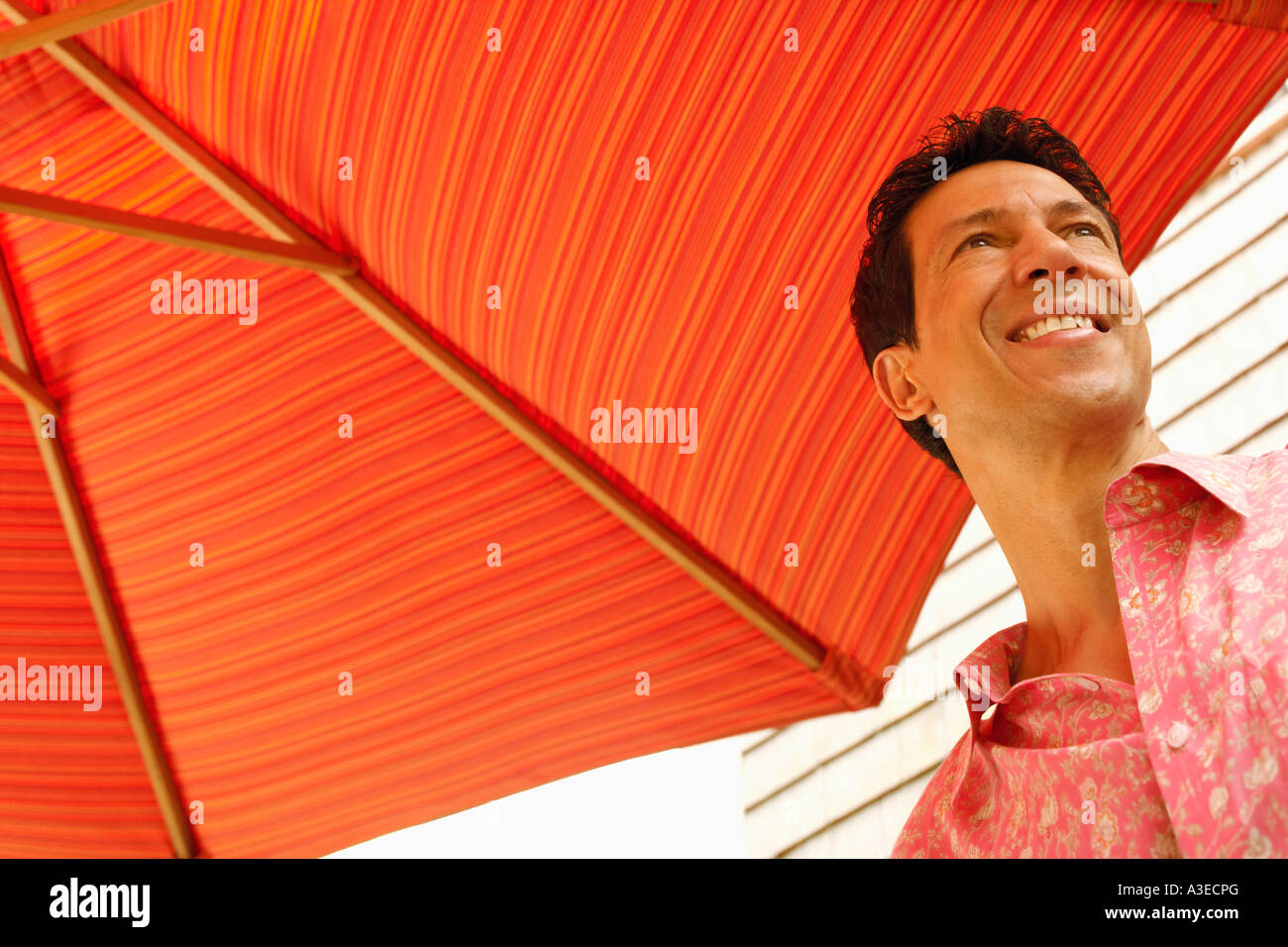 Low angle view of a mature man smiling Stock Photo - Alamy