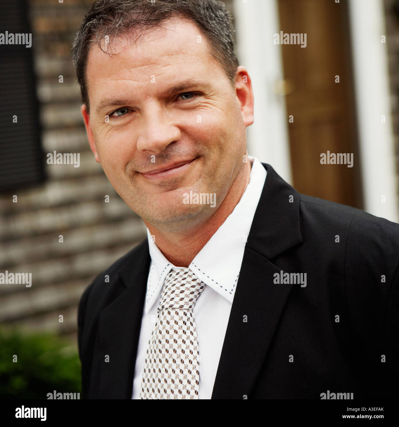 Portrait of a businessman smiling Stock Photo - Alamy