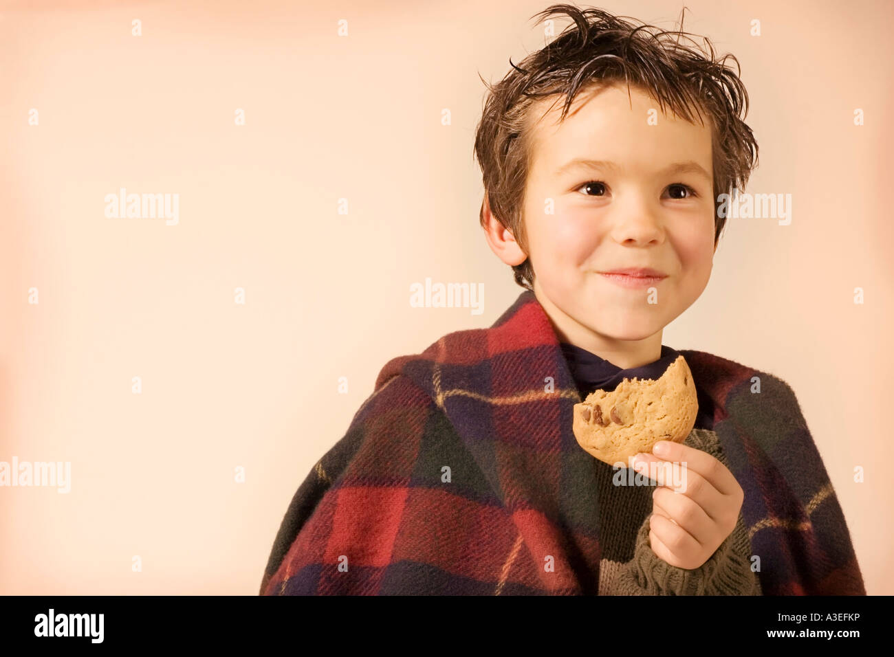 Young boy with cookie Stock Photo - Alamy