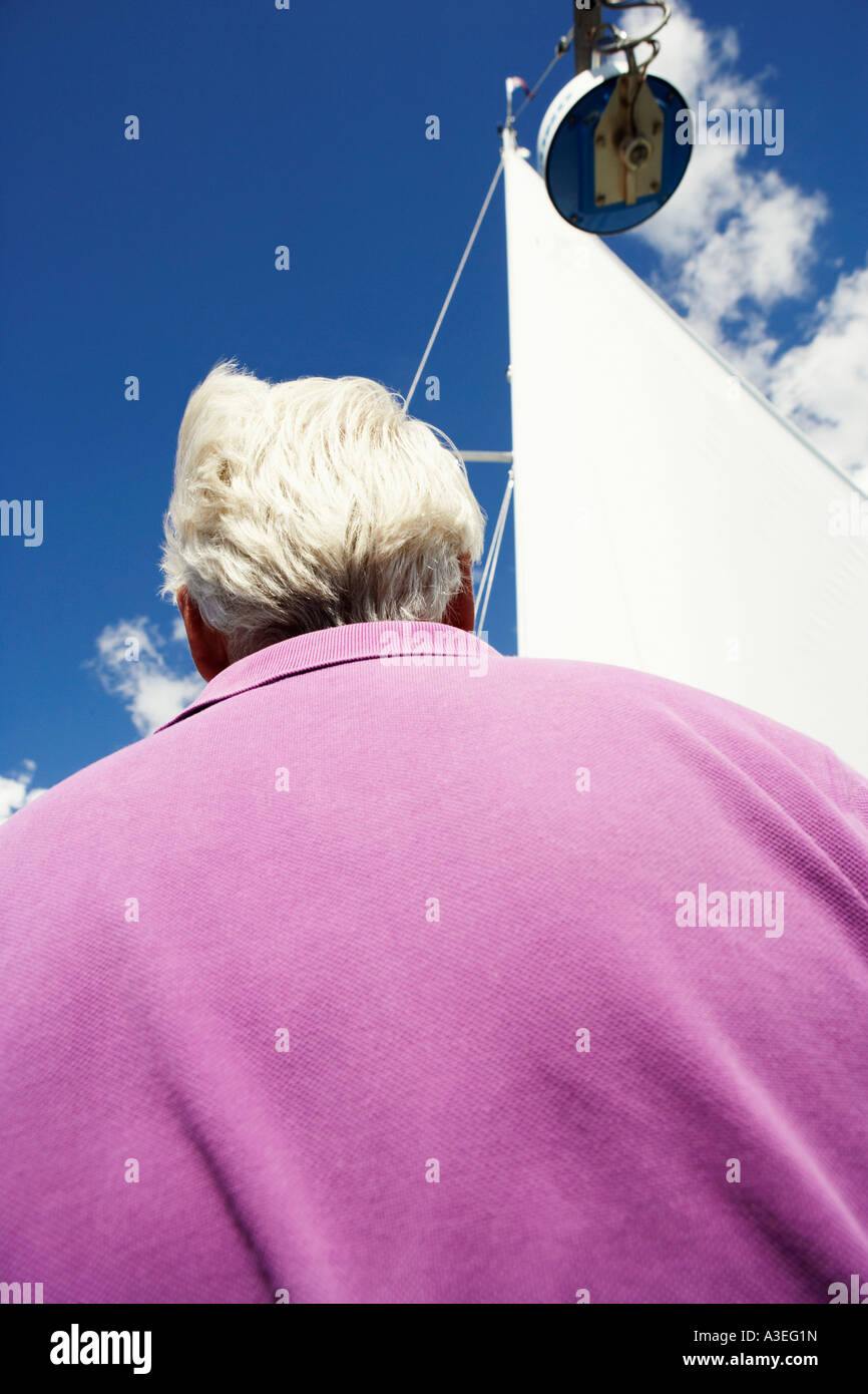 Rear view of a mature man in a sailboat Stock Photo - Alamy