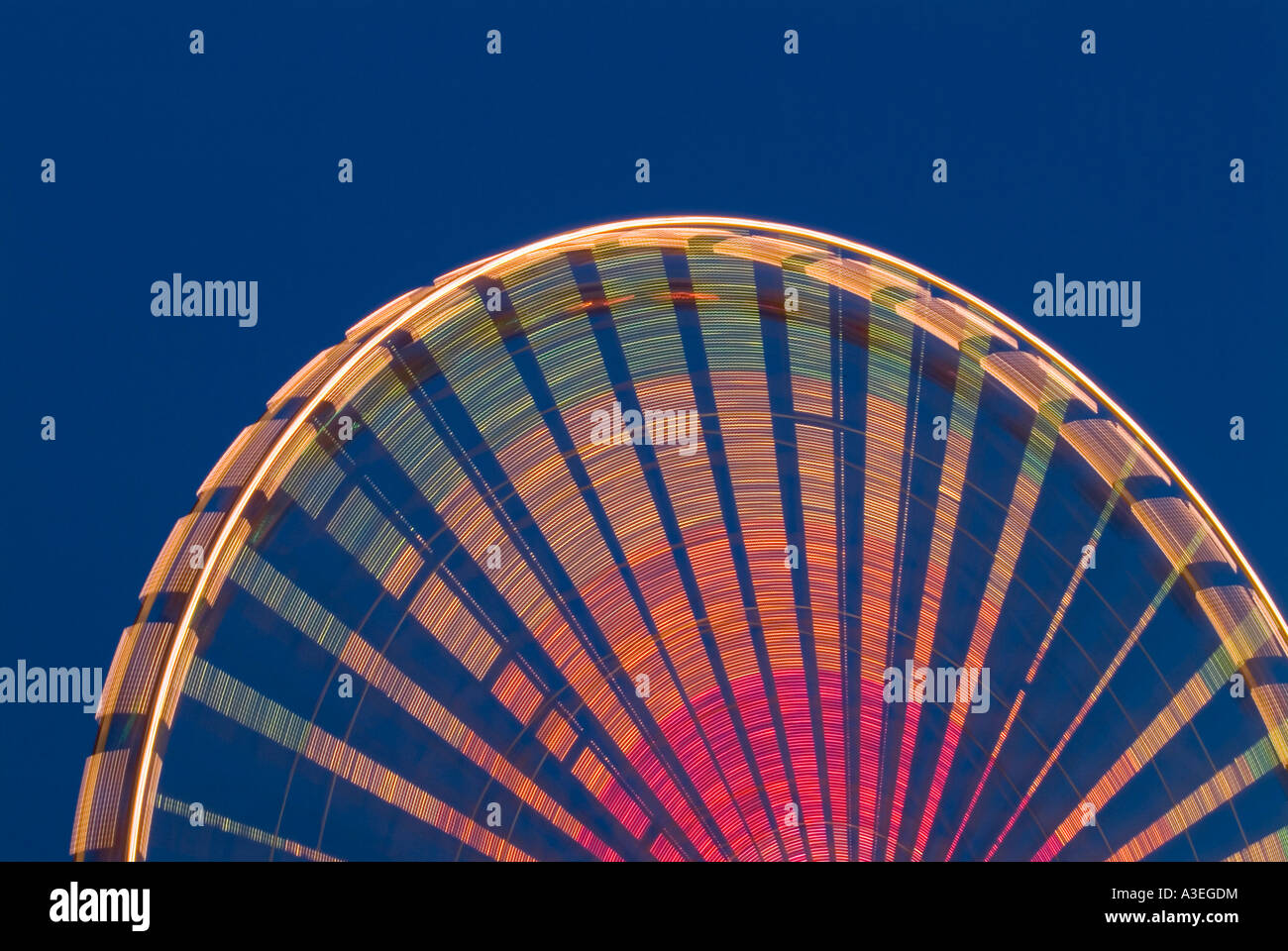 Ferris Wheel on a Parish Fair in movement Stock Photo - Alamy