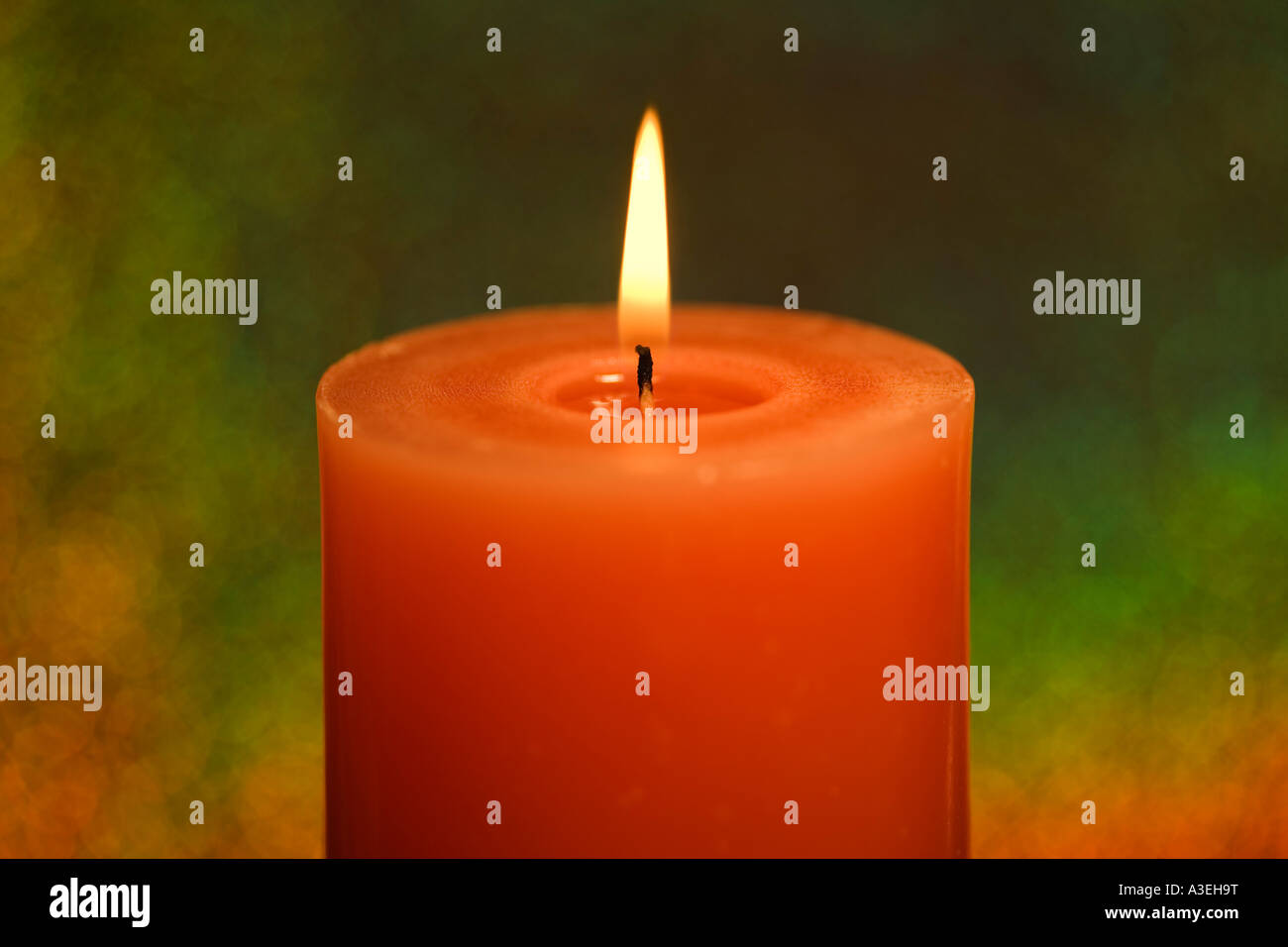 Burning red candle Stock Photo - Alamy