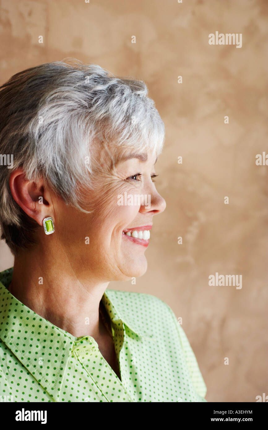Side profile of a senior woman smiling Stock Photo - Alamy