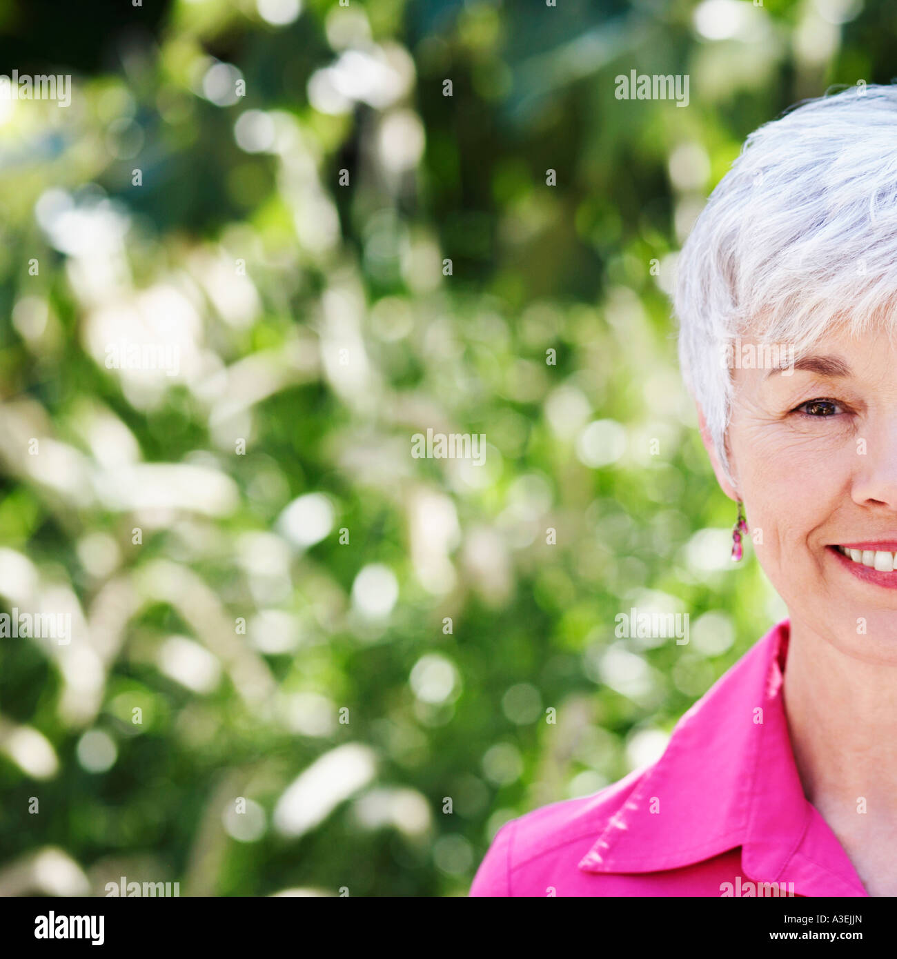 Portrait of a senior woman smiling Stock Photo - Alamy