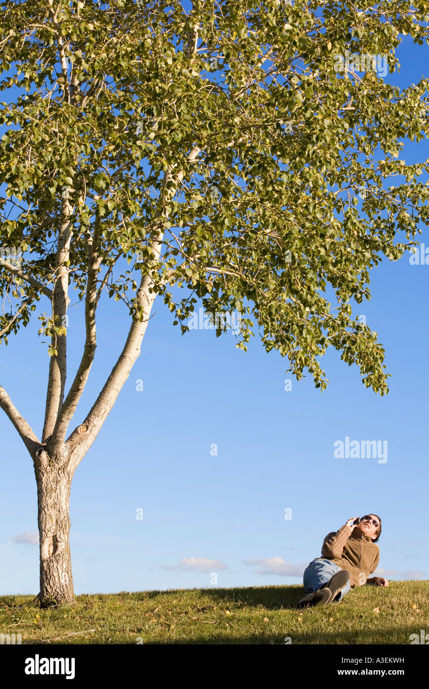 Man resting under tree Stock Photo - Alamy