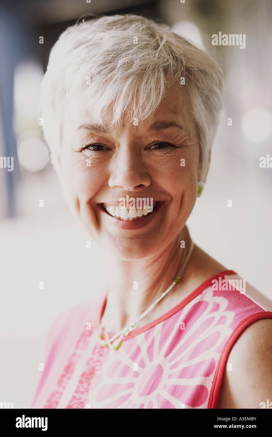 Portrait of a senior woman smiling Stock Photo - Alamy