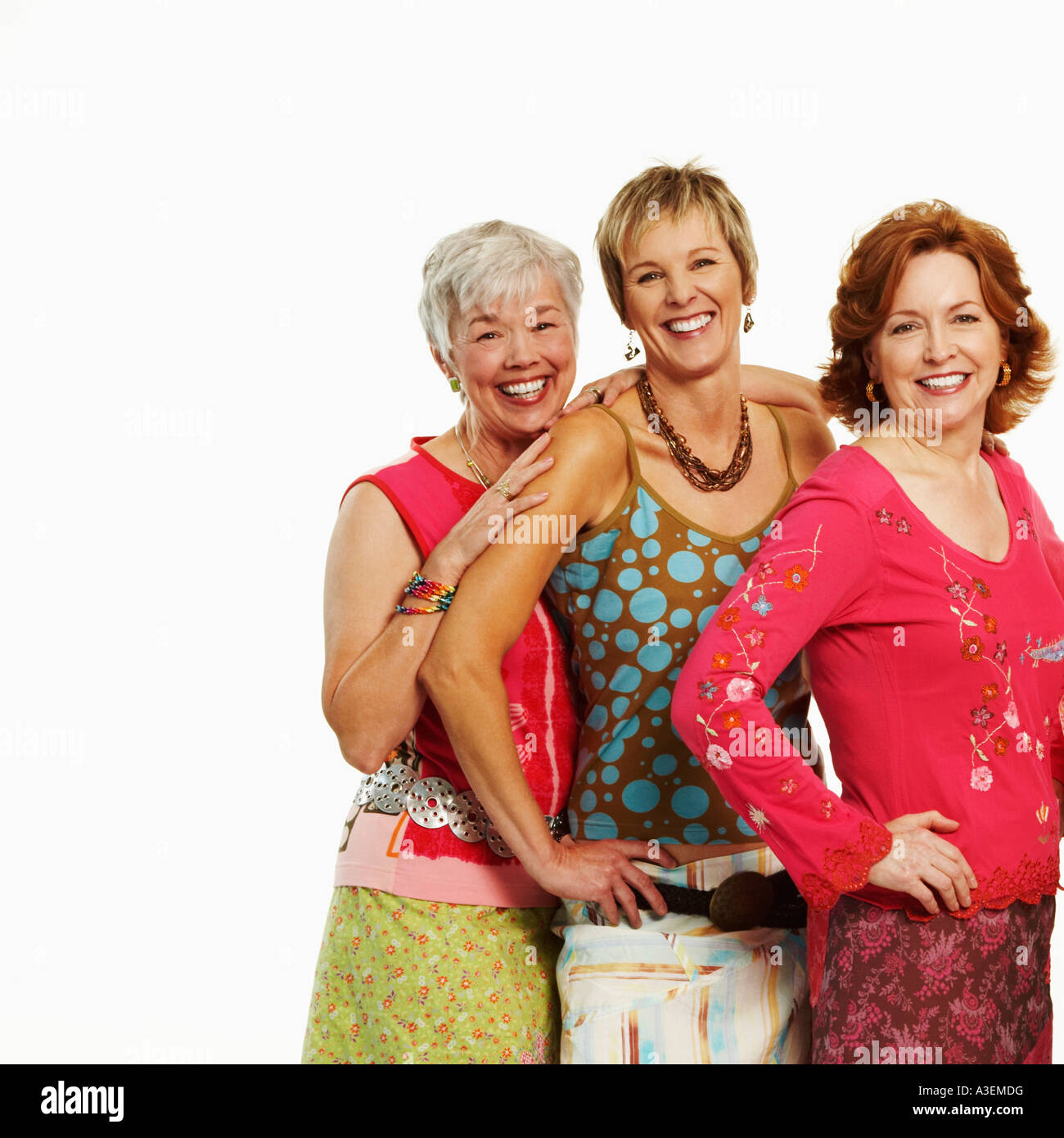 Portrait of three mature women standing together and smiling Stock ...