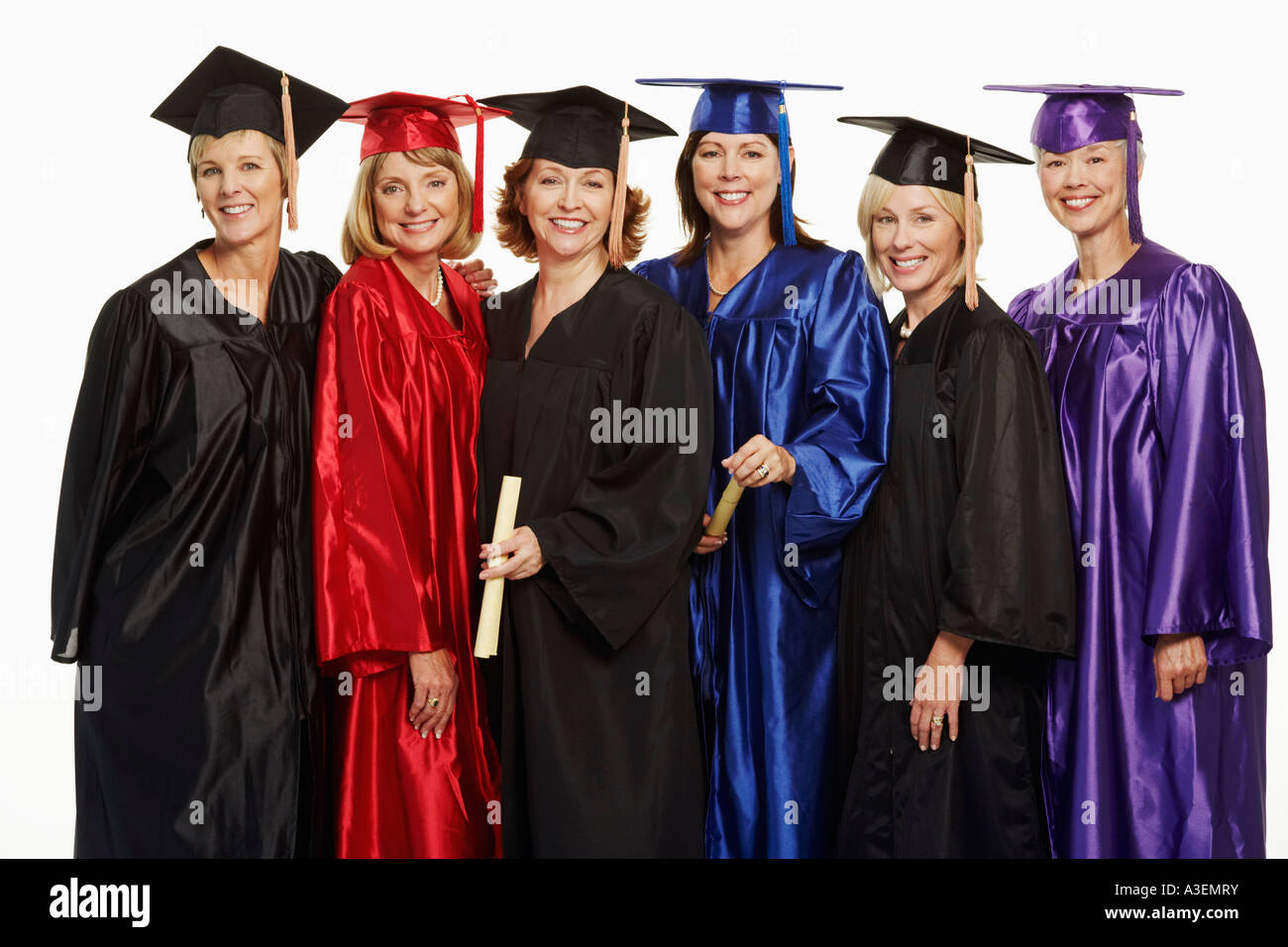 Portrait of a group of mature women wearing graduation gowns Stock ...