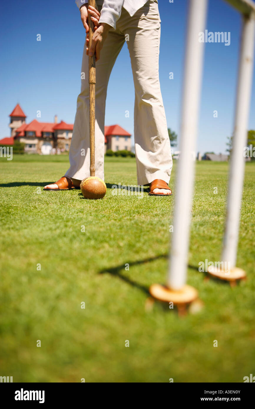 Low section view of a woman playing croquet in a field Stock Photo - Alamy