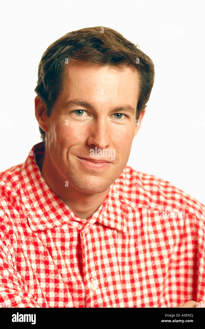 Portrait of a mid adult man smirking Stock Photo - Alamy