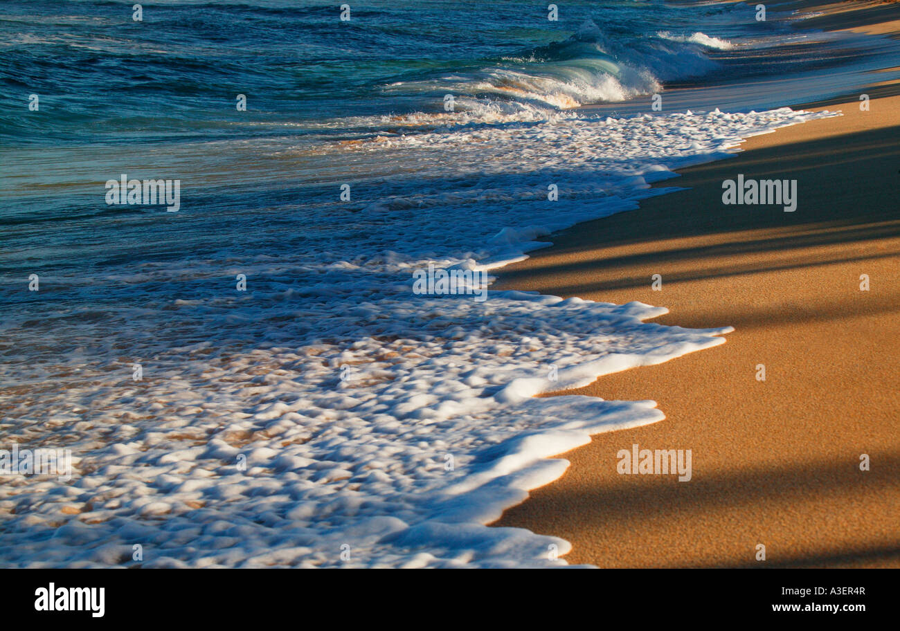 Tide on a beach Stock Photo - Alamy