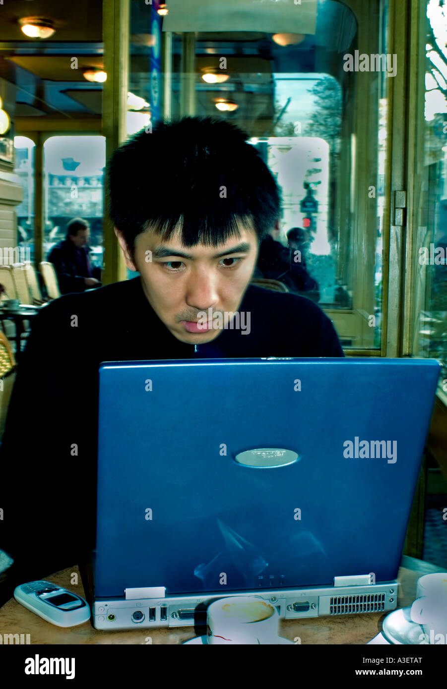 Paris FRANCE, Young Chinese Man, Using WI Fi Internet Technology on ...