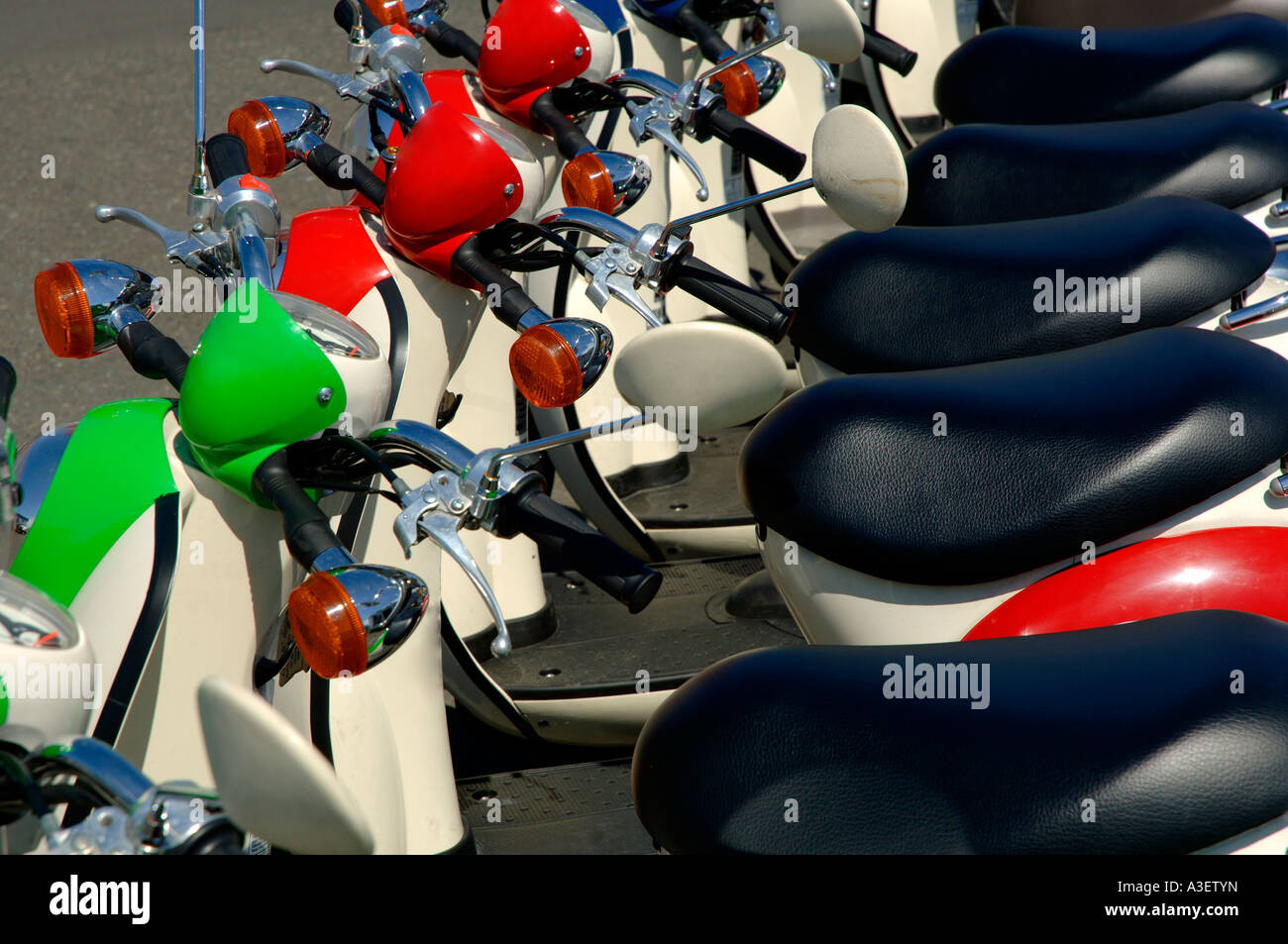 Scooters in a row Stock Photo - Alamy