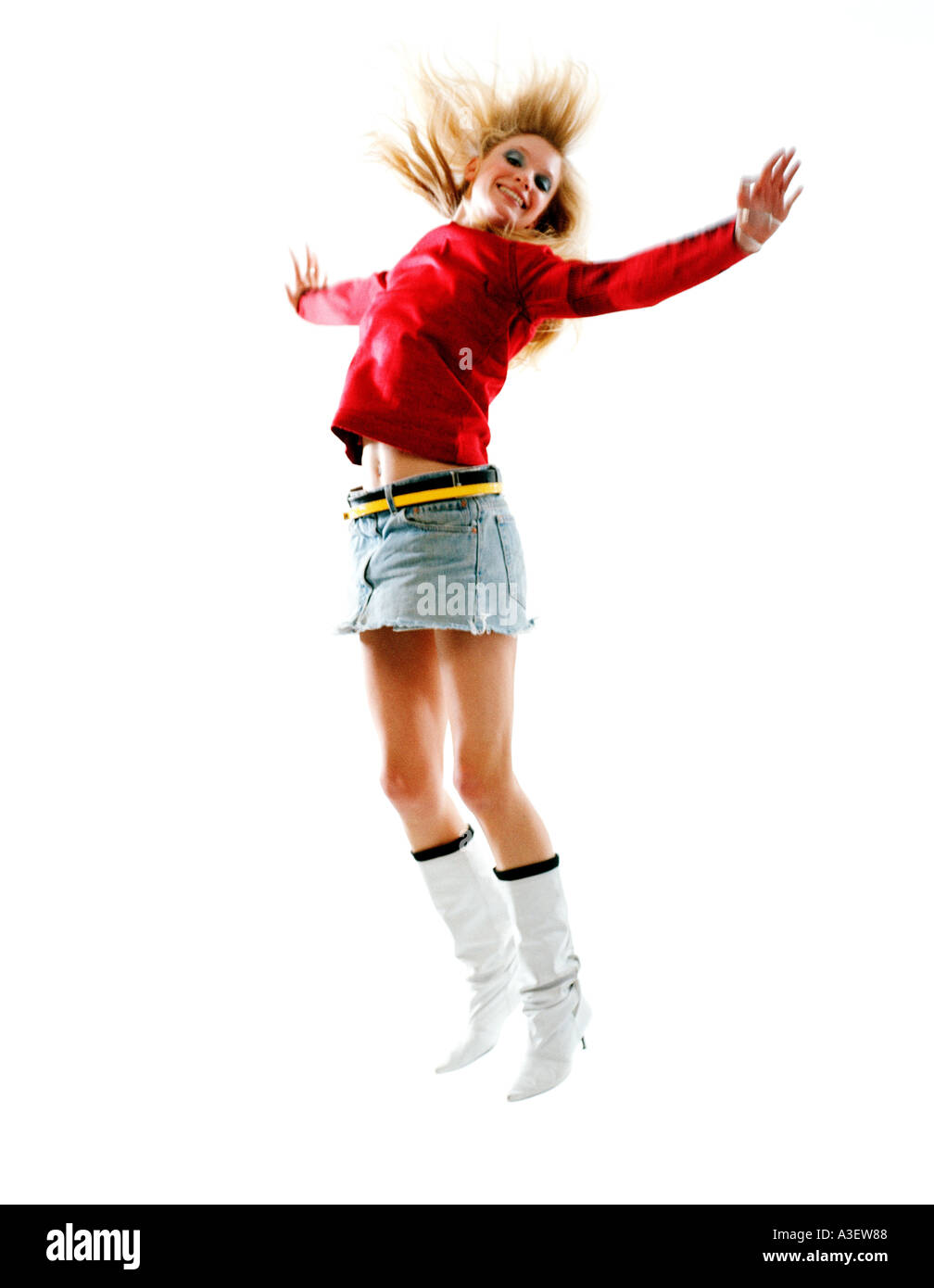 blond girl jumping sideways Stock Photo - Alamy