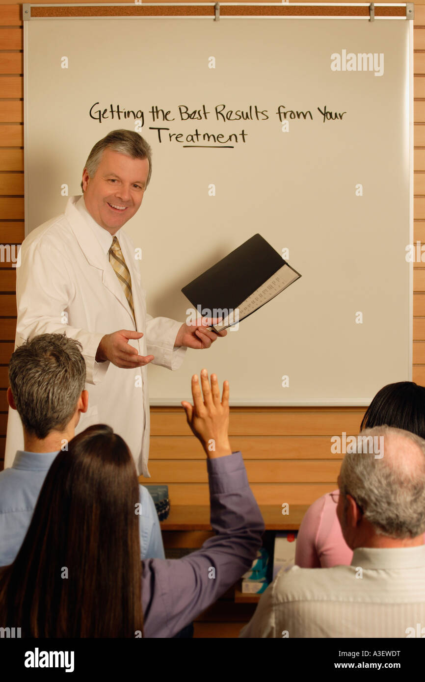 Doctor answering questions Stock Photo - Alamy