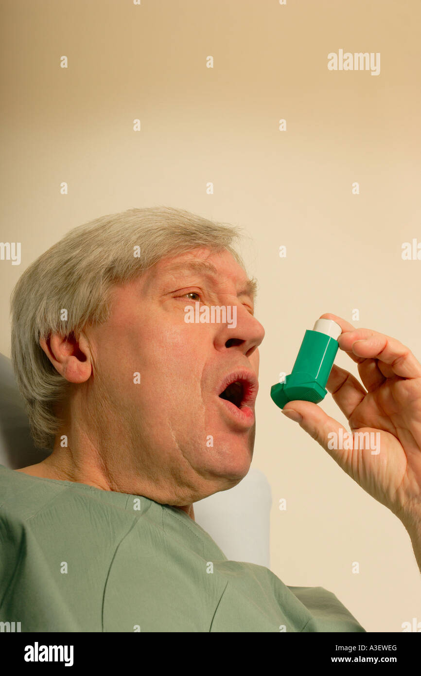 Man with an inhaler Stock Photo - Alamy