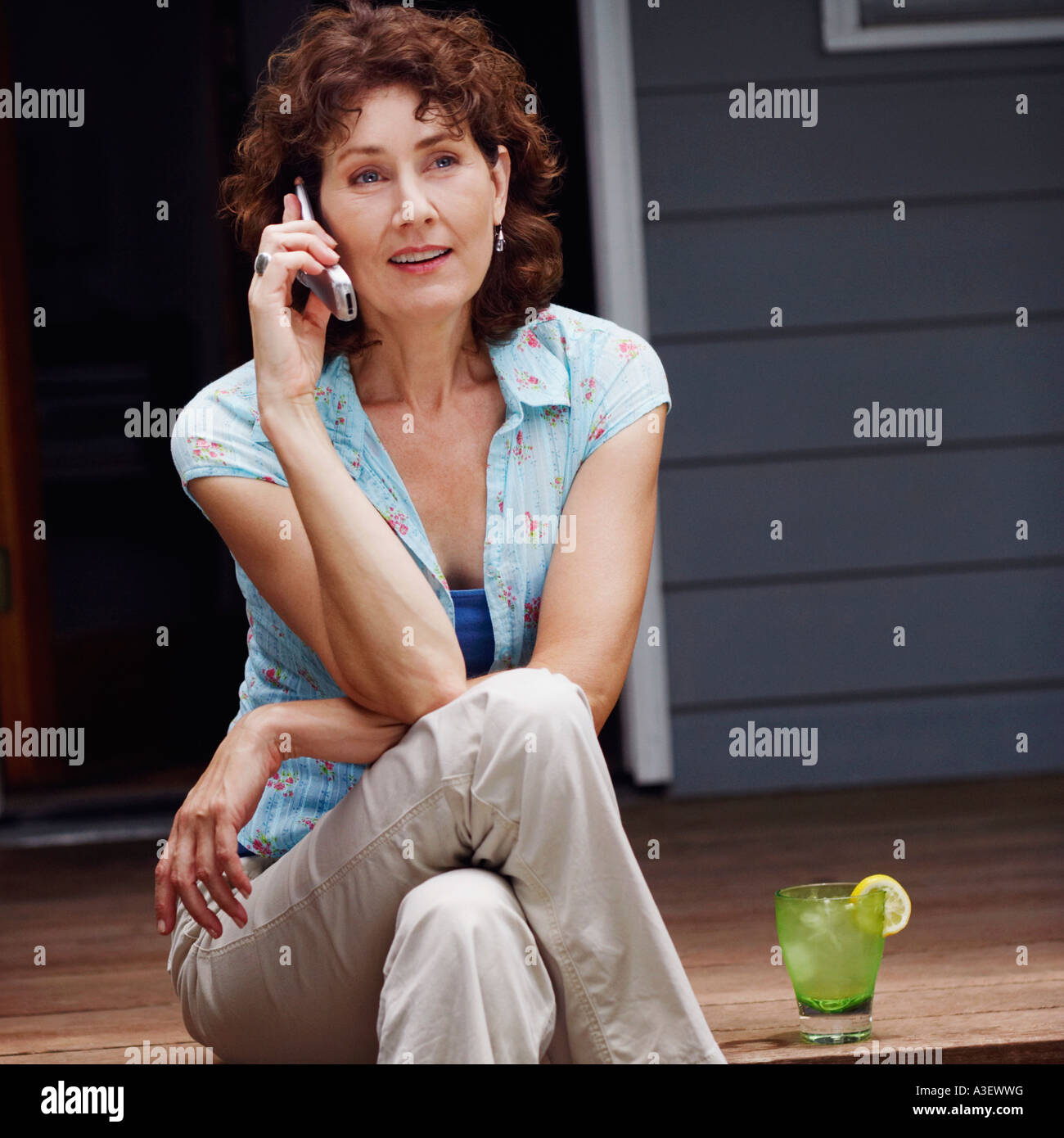 Mature woman talking on a mobile phone Stock Photo - Alamy