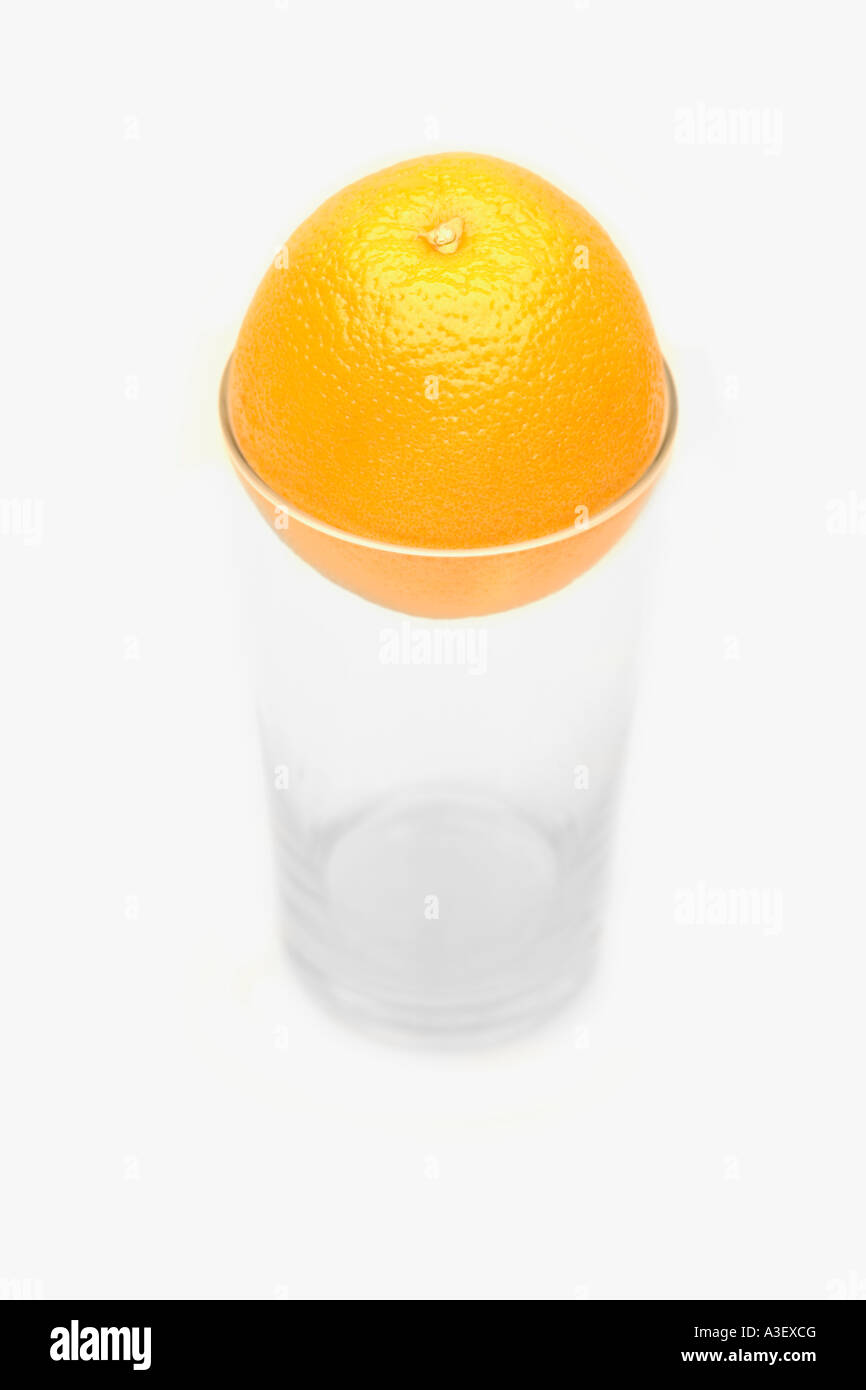 Orange and empty cup Stock Photo - Alamy