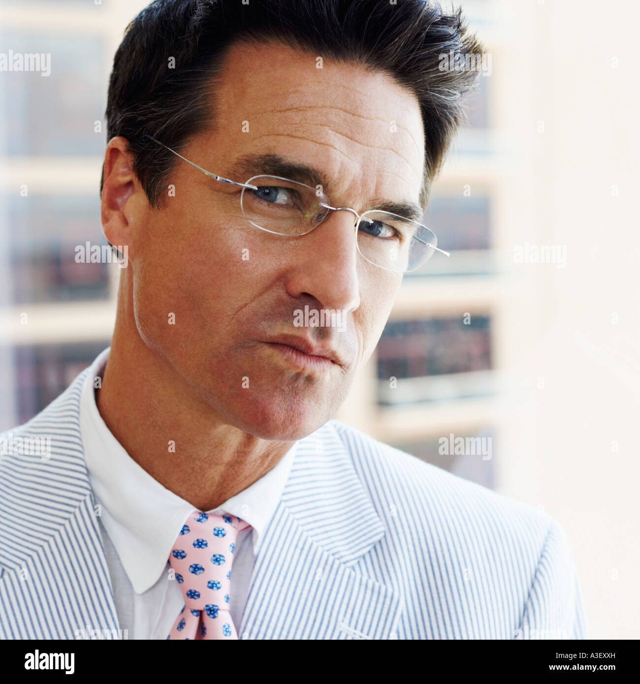 Portrait of a businessman looking serious Stock Photo - Alamy