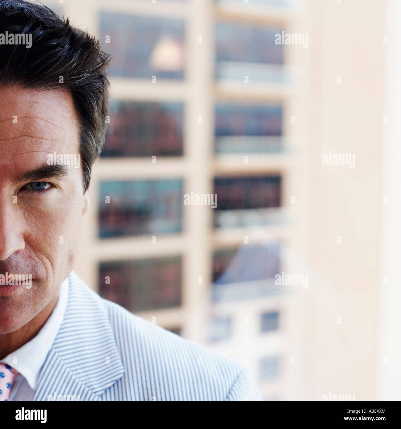 Portrait of a businessman looking serious Stock Photo - Alamy