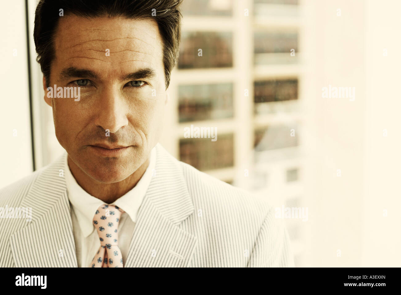 Portrait of a businessman looking serious Stock Photo - Alamy