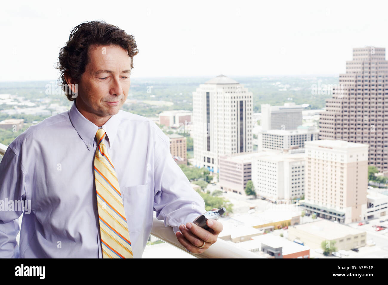 Close-up of a businessman looking at a mobile phone Stock Photo - Alamy