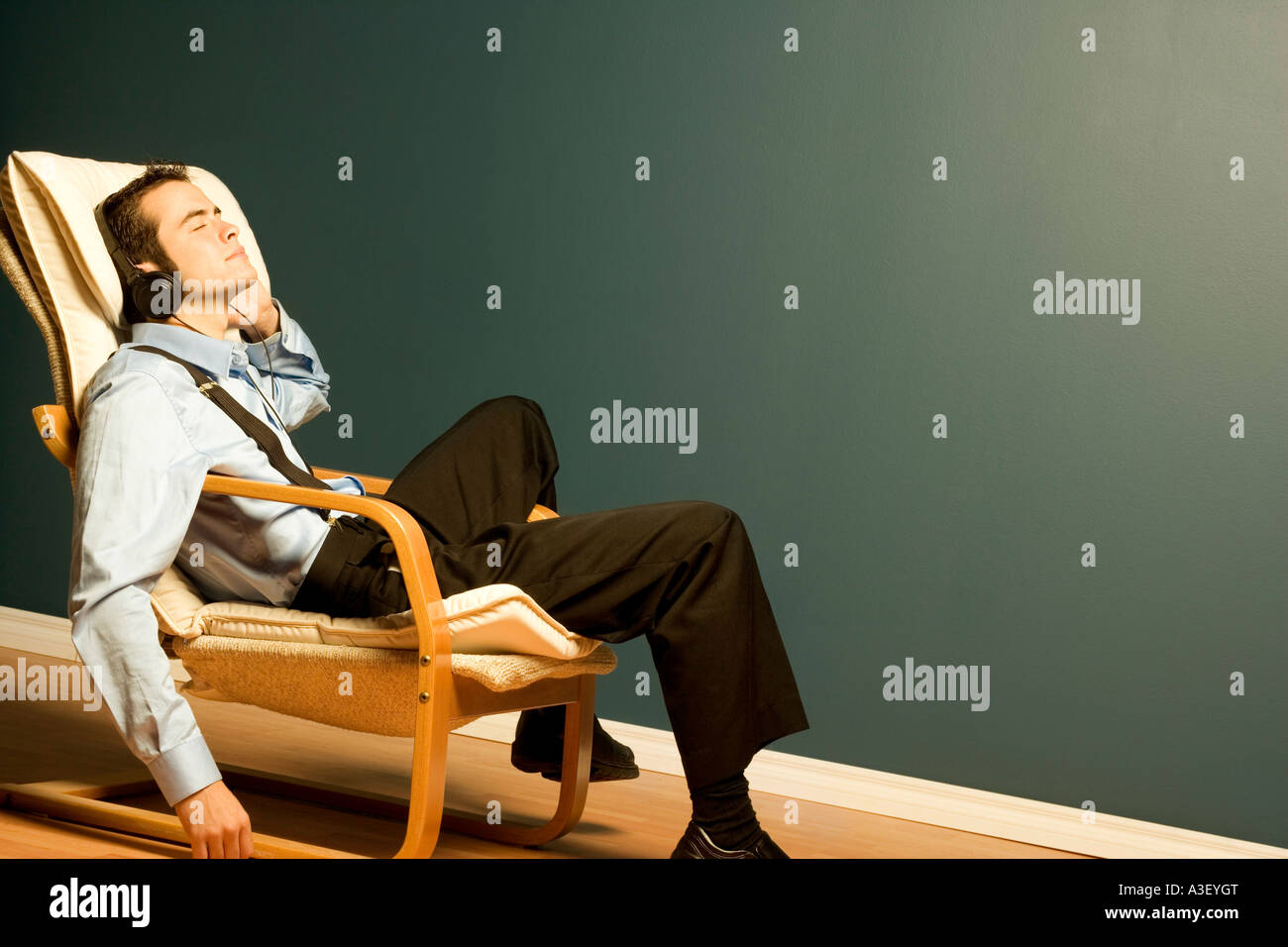 Man relaxing to music Stock Photo - Alamy