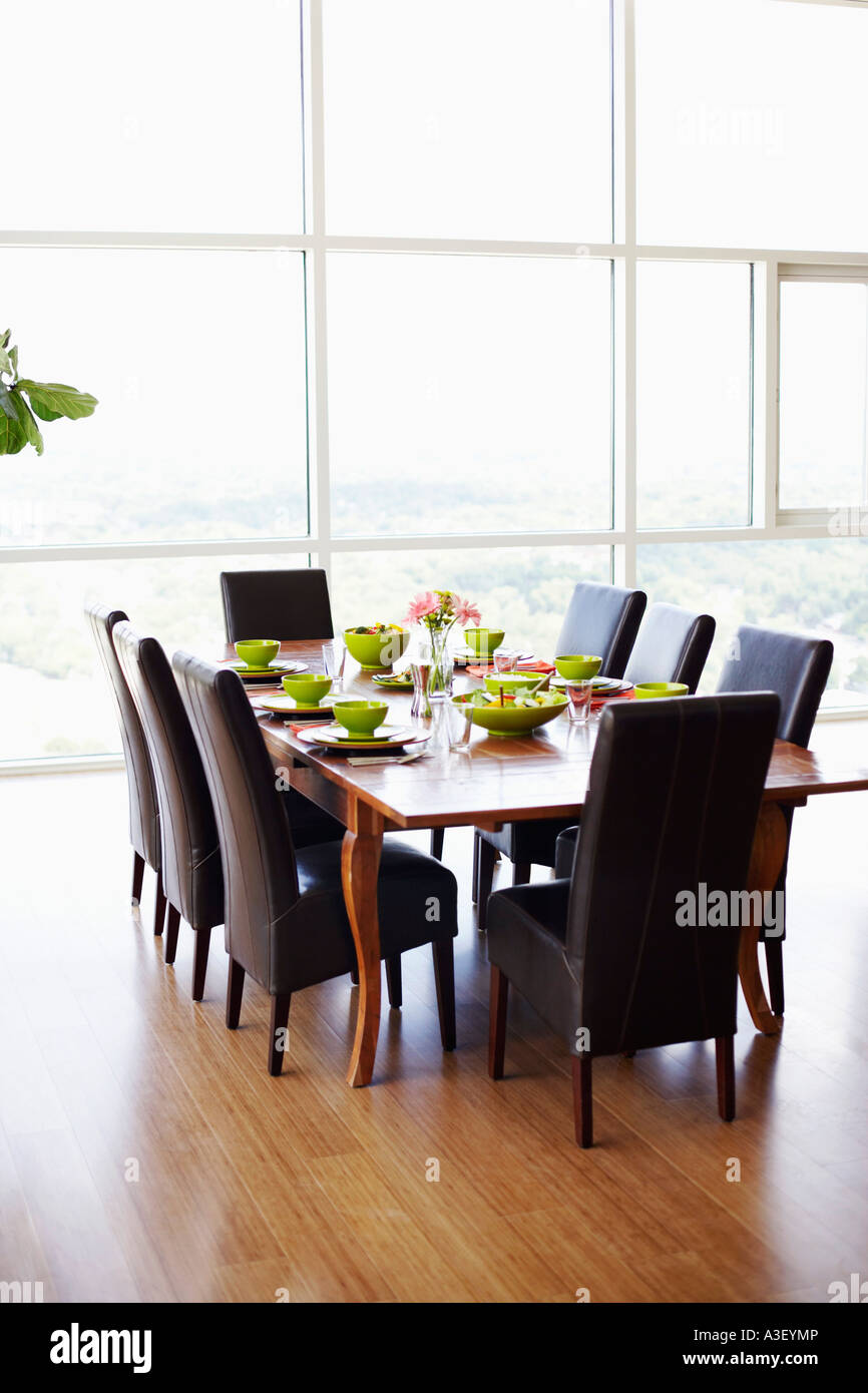 Dining table with empty chairs in a dining room Stock Photo - Alamy
