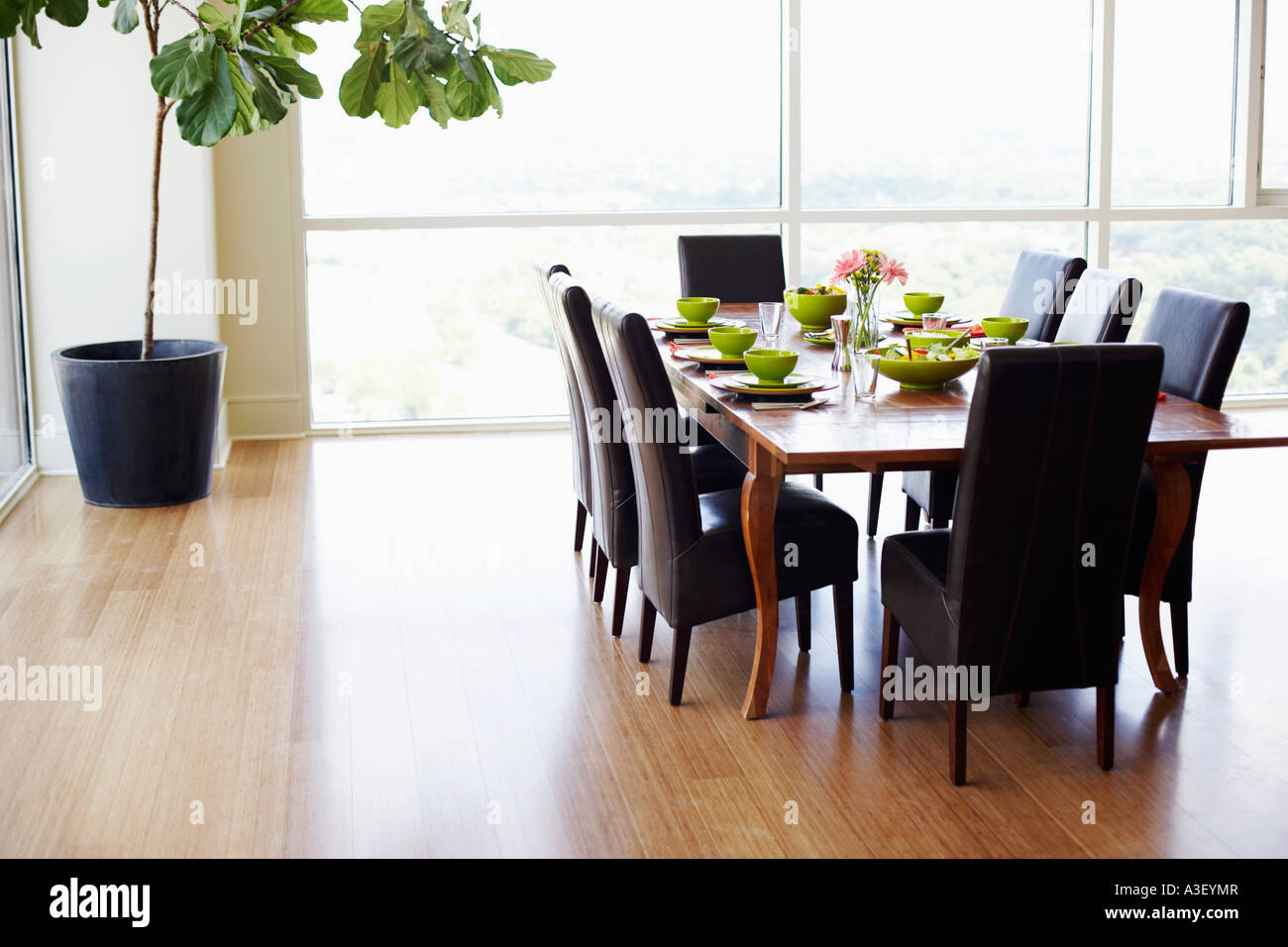 Dining table with empty chairs in a dining room Stock Photo - Alamy