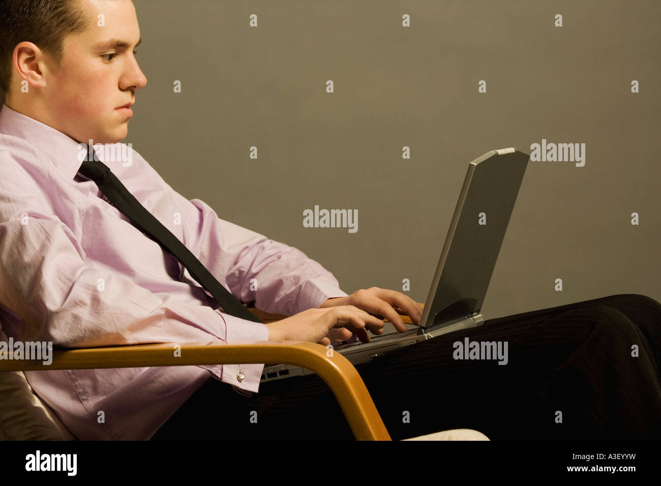 Man working on a laptop Stock Photo - Alamy