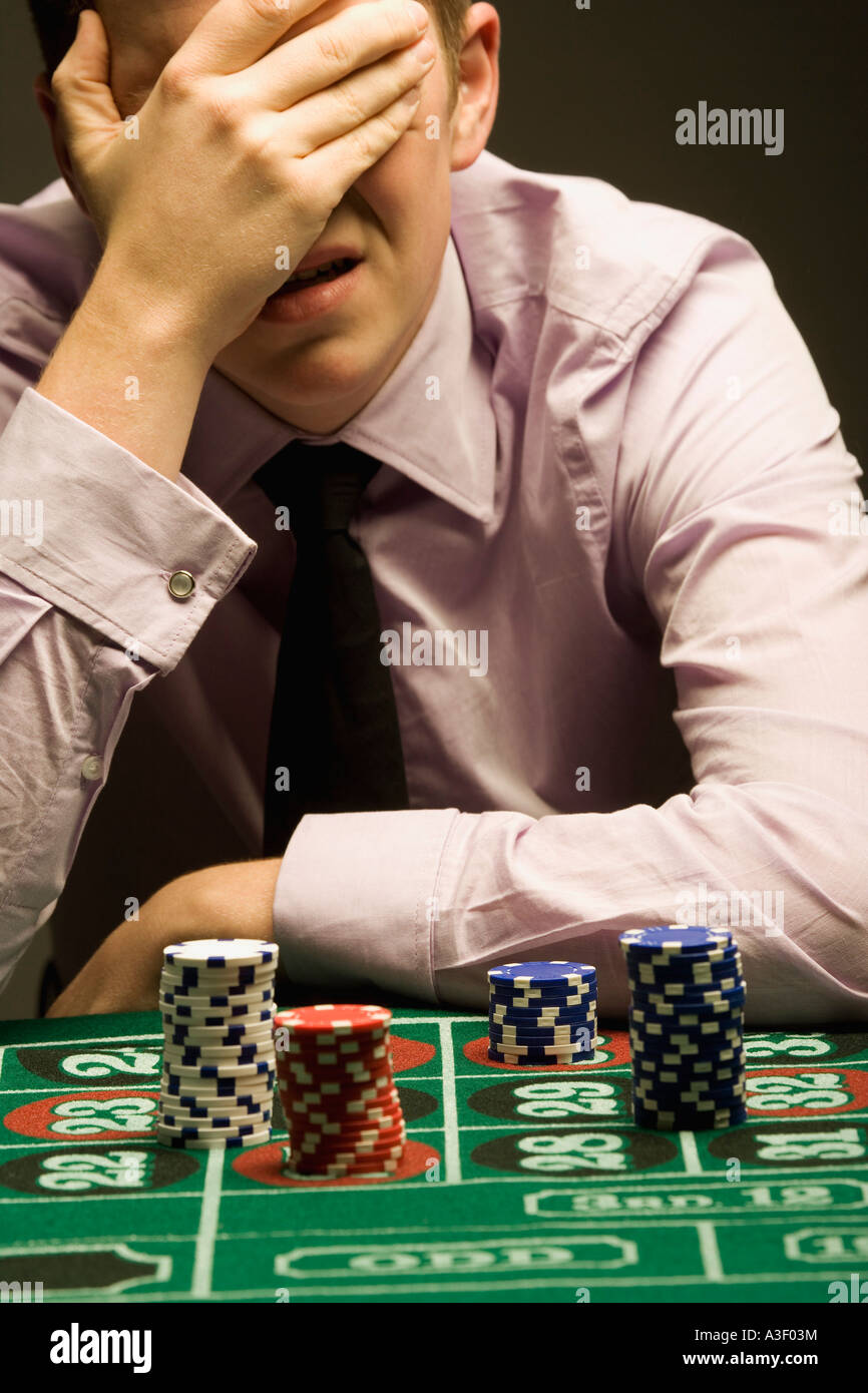 Man losing at roulette Stock Photo - Alamy