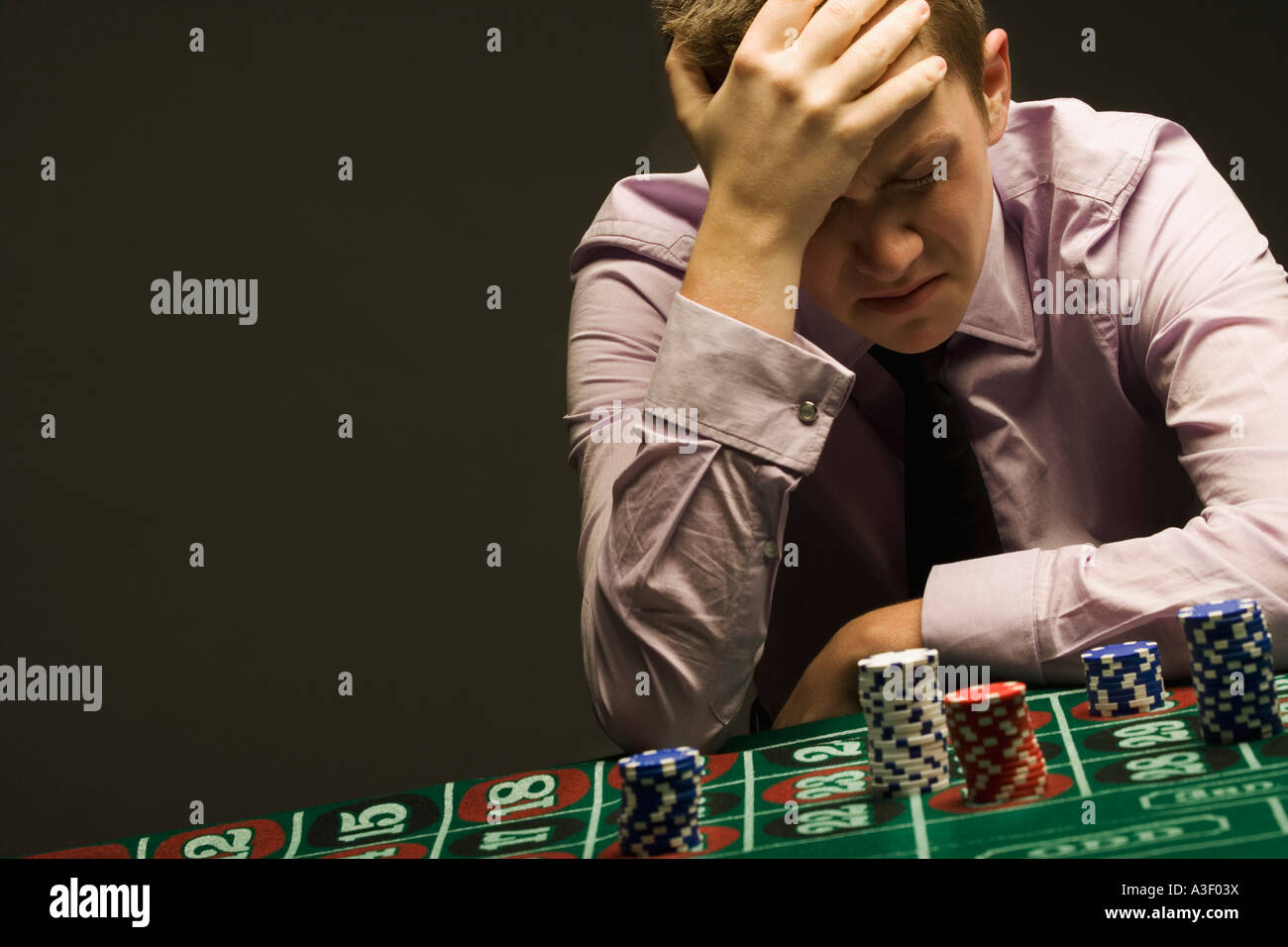 Man losing at roulette Stock Photo - Alamy