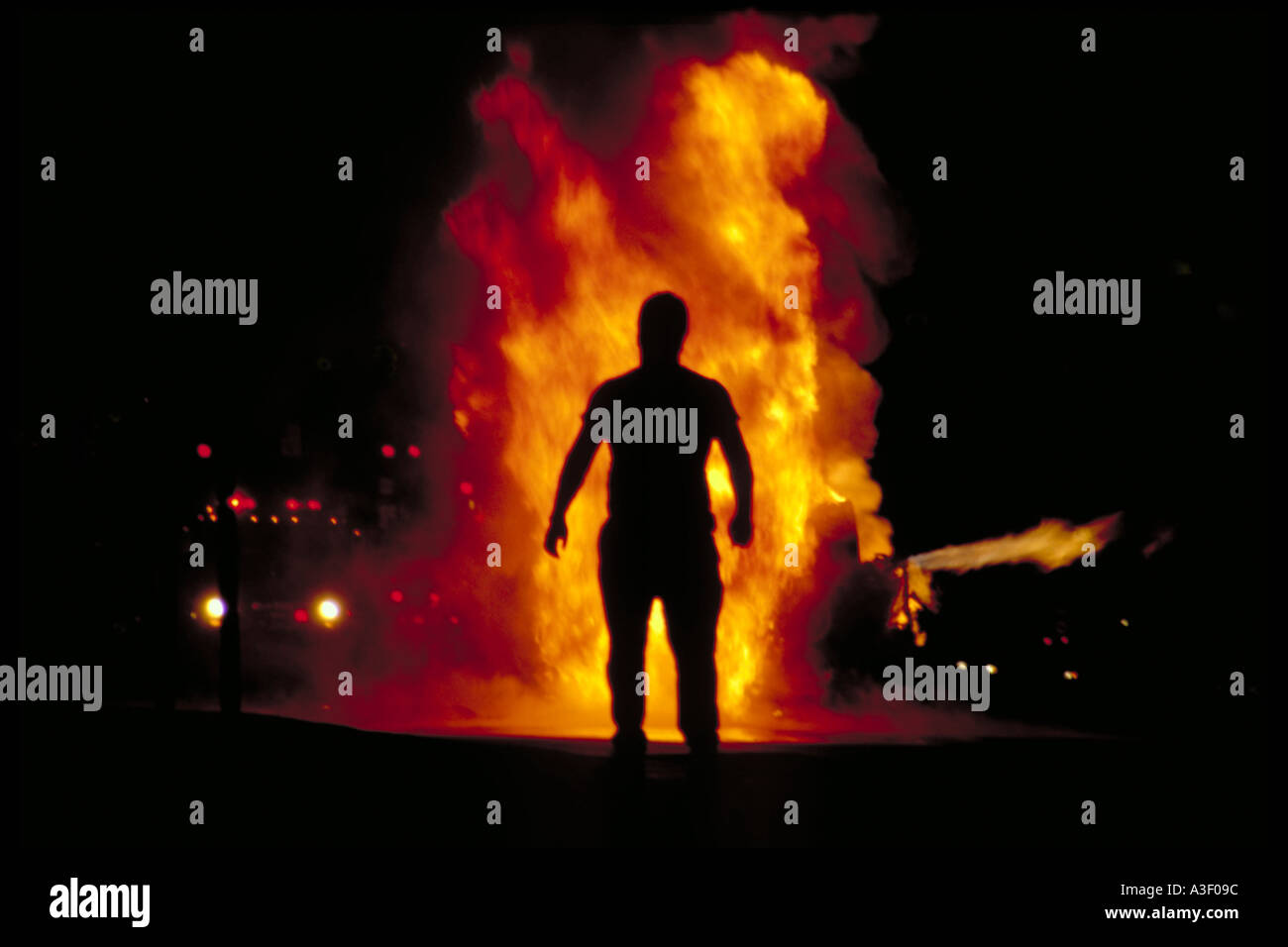 Man infront of fire Stock Photo - Alamy