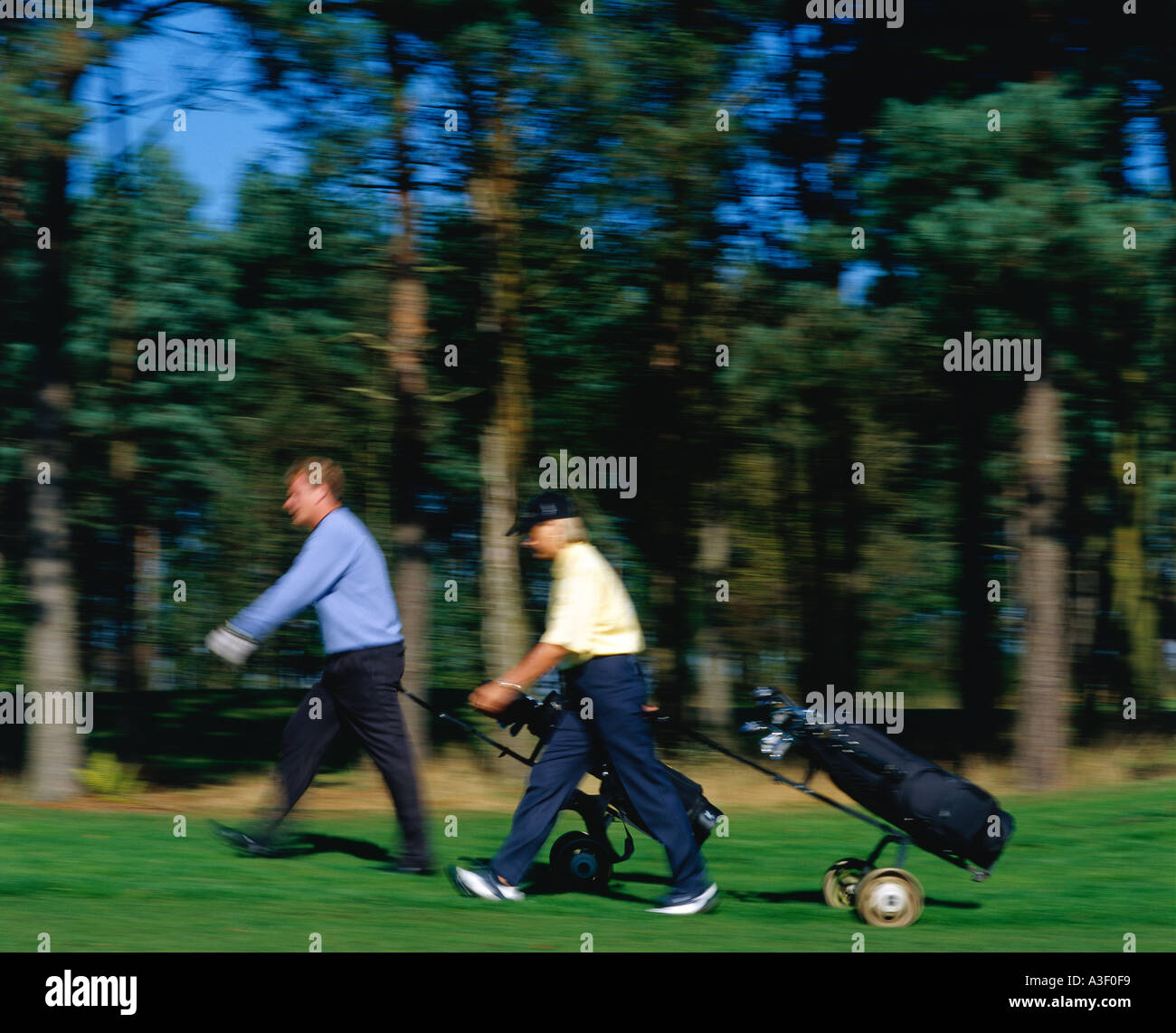 Golf players hi-res stock photography and images - Alamy