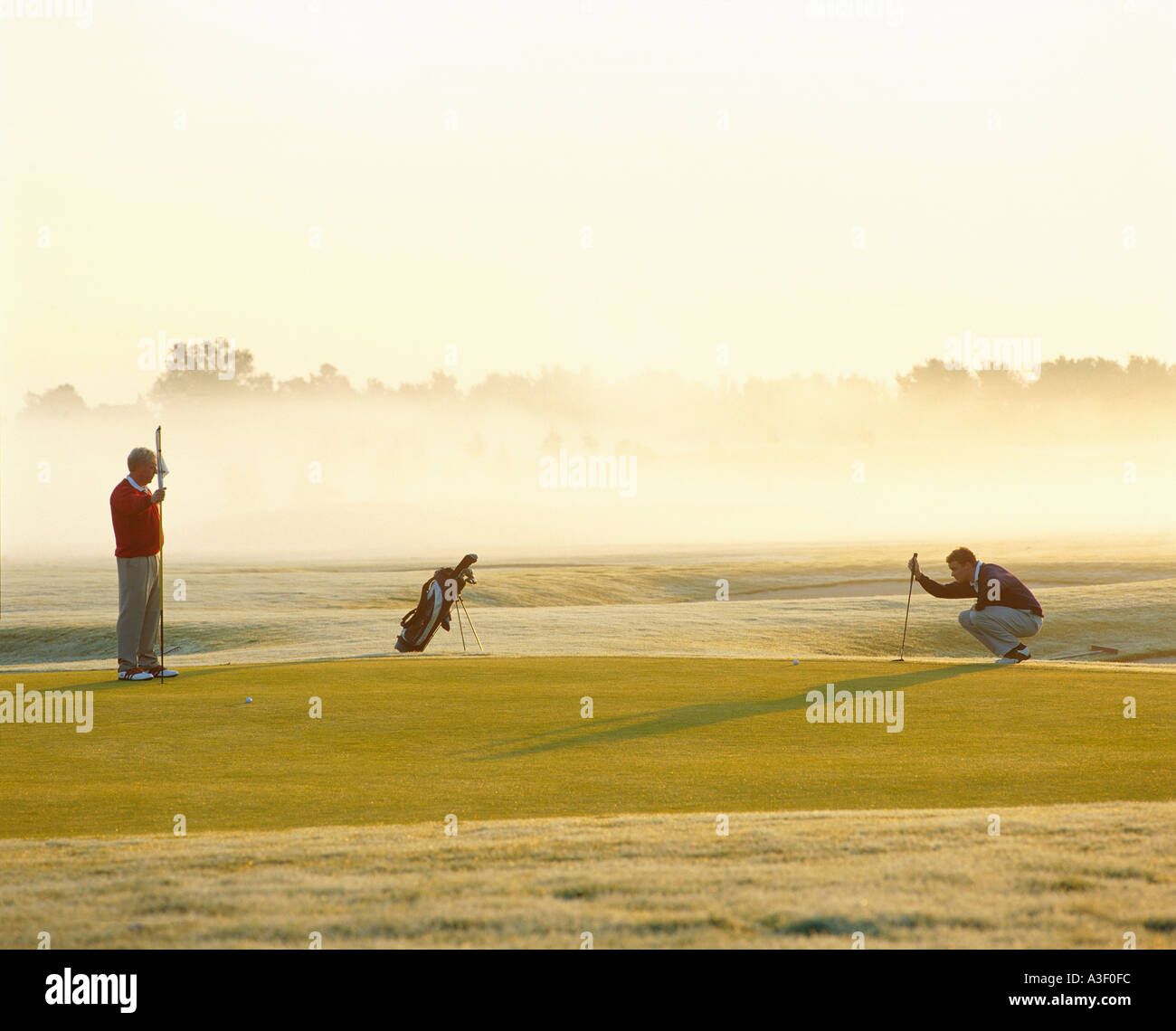 Morning golfers hi-res stock photography and images - Alamy
