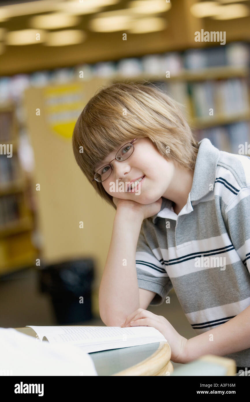 Boy in a library Stock Photo - Alamy