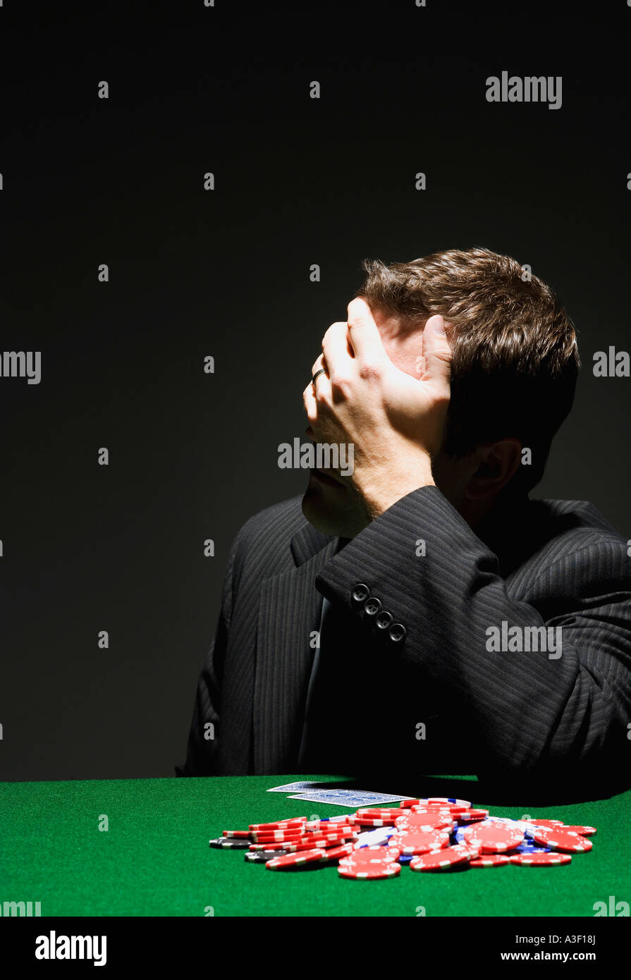 Man losing at poker Stock Photo - Alamy