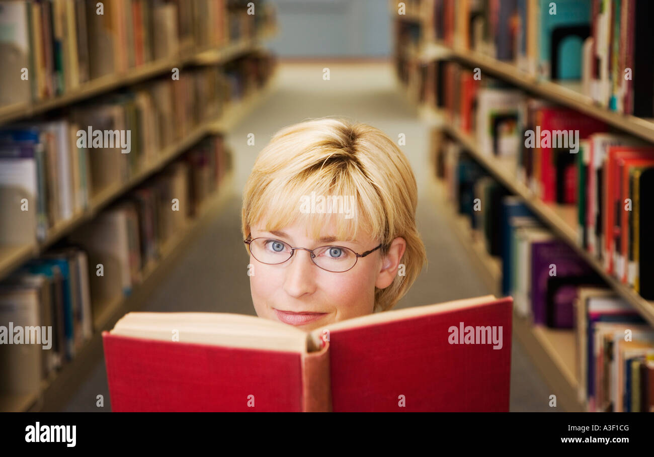 Woman in the library Stock Photo - Alamy