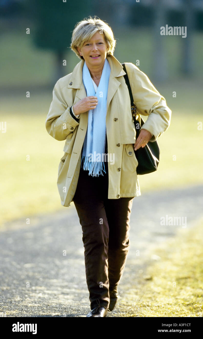 MR MATURE WOMAN STROLLING Stock Photo - Alamy