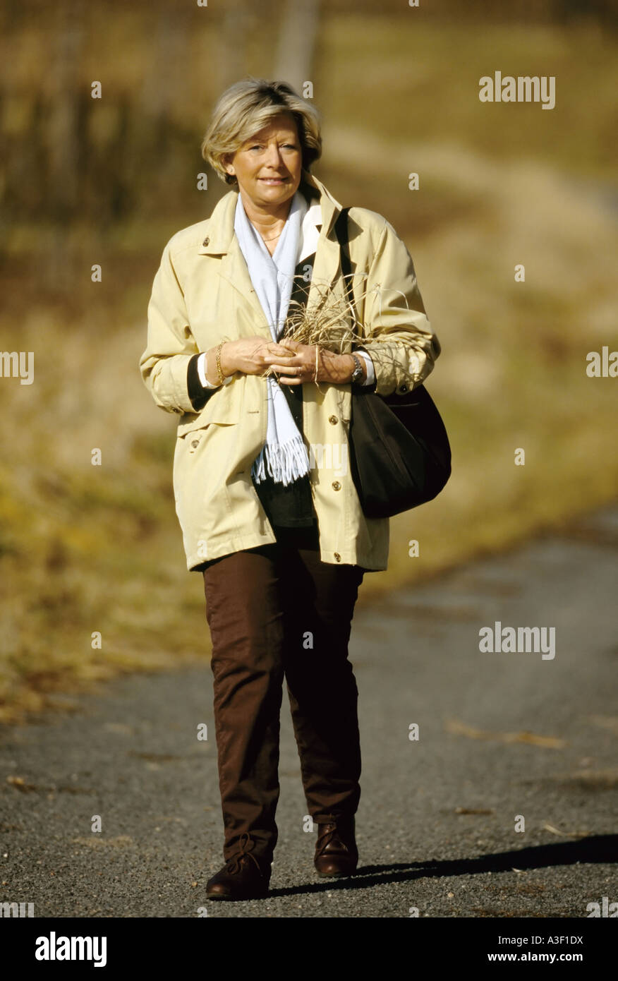 MR MATURE WOMAN STROLLING Stock Photo - Alamy