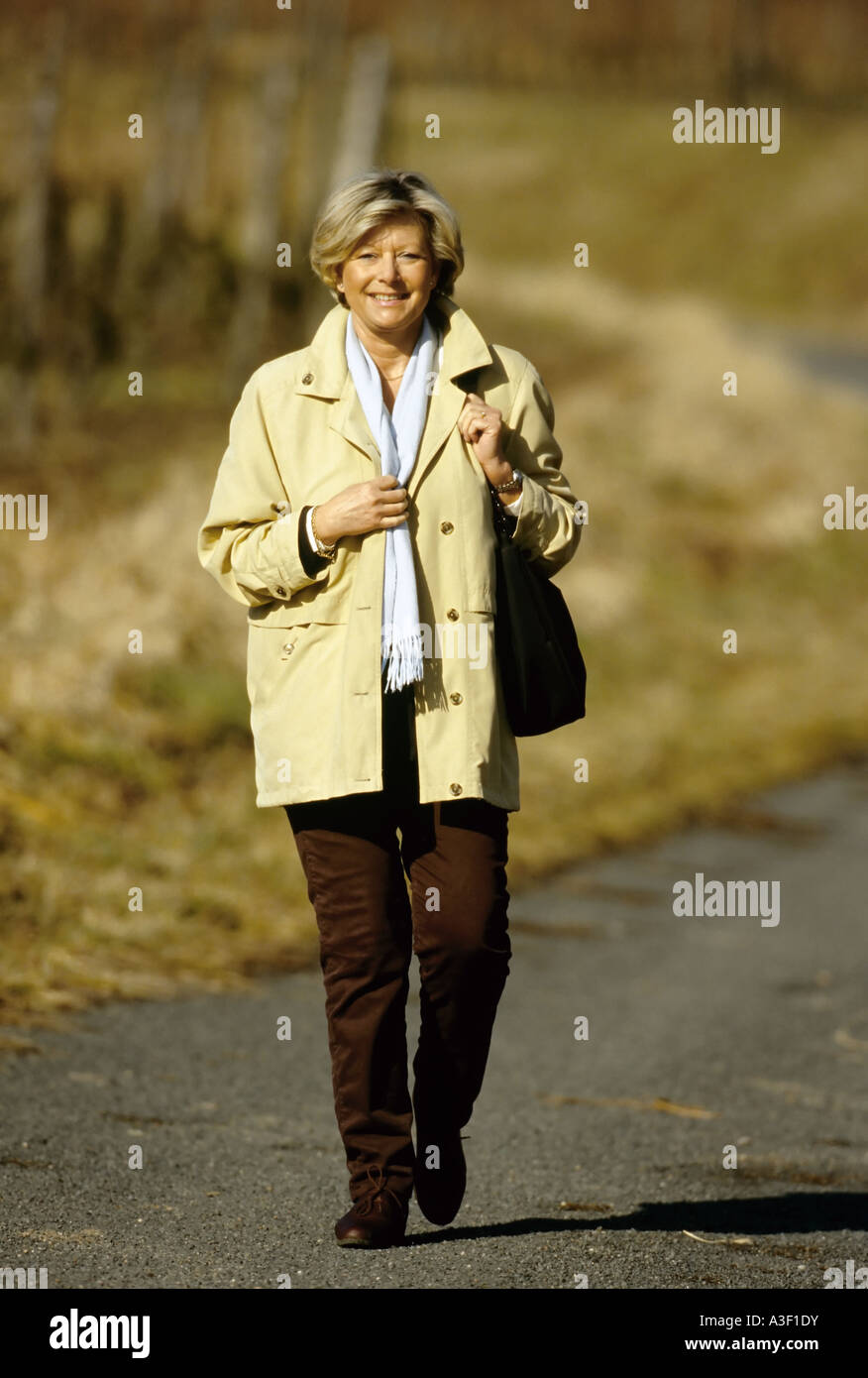 MR MATURE WOMAN STROLLING Stock Photo - Alamy