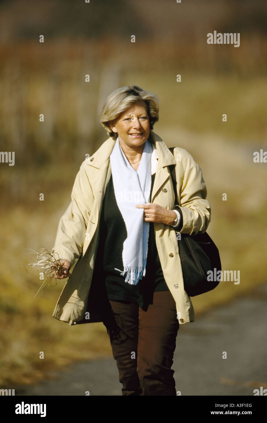 MR MATURE WOMAN STROLLING Stock Photo - Alamy