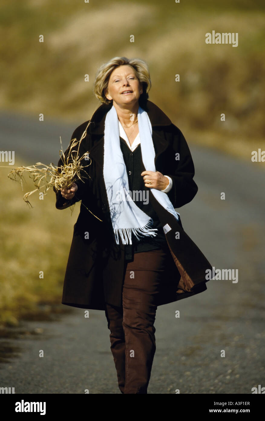MR MATURE WOMAN STROLLING Stock Photo - Alamy